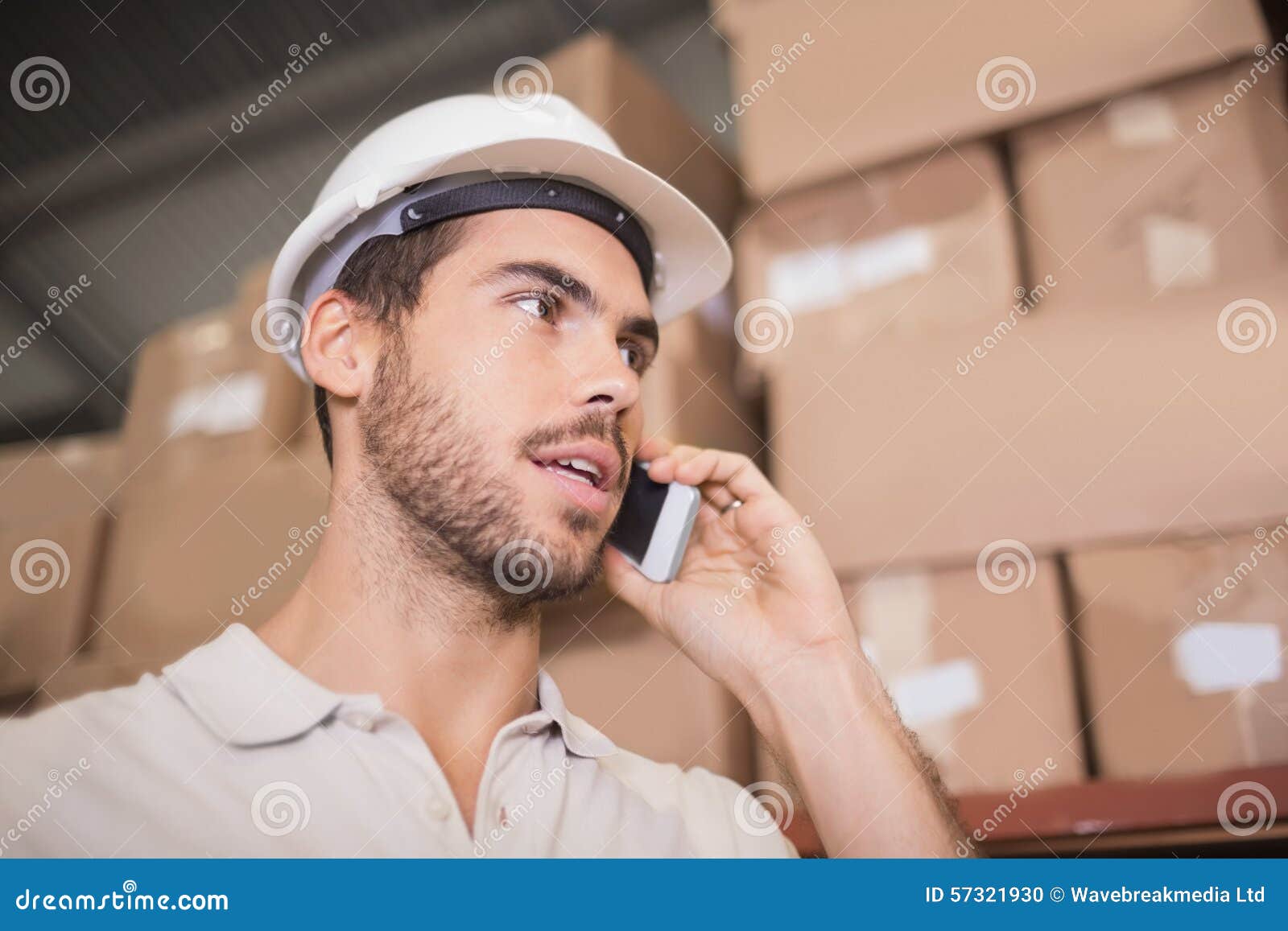 Worker Using Cellphone in Warehouse Stock Photo - Image of caucasian ...