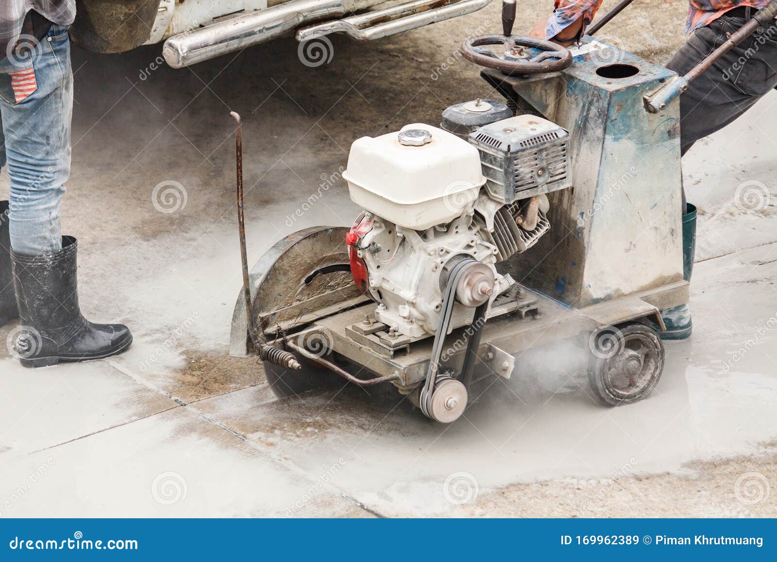 Worker Using Diamond Saw Blade Machine Cutting Concrete Road at ...