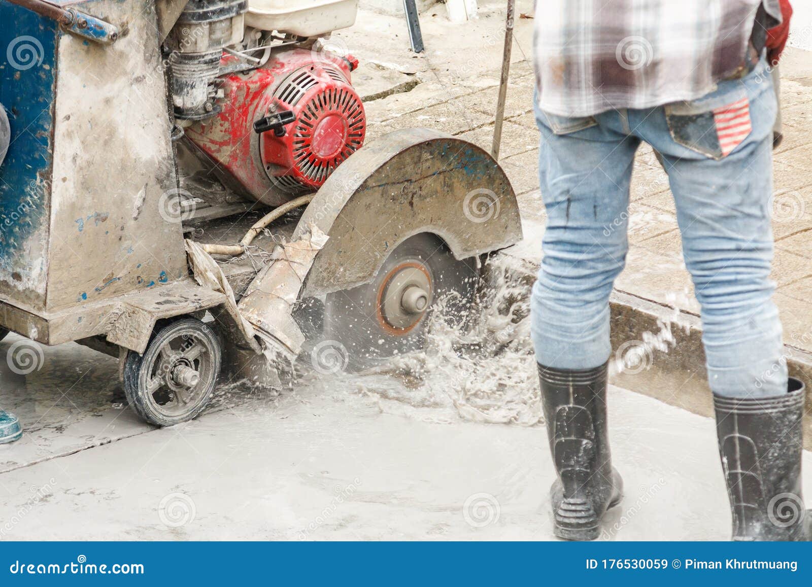 Worker Using Diamond Saw Blade Machine Cutting Concrete Road at ...