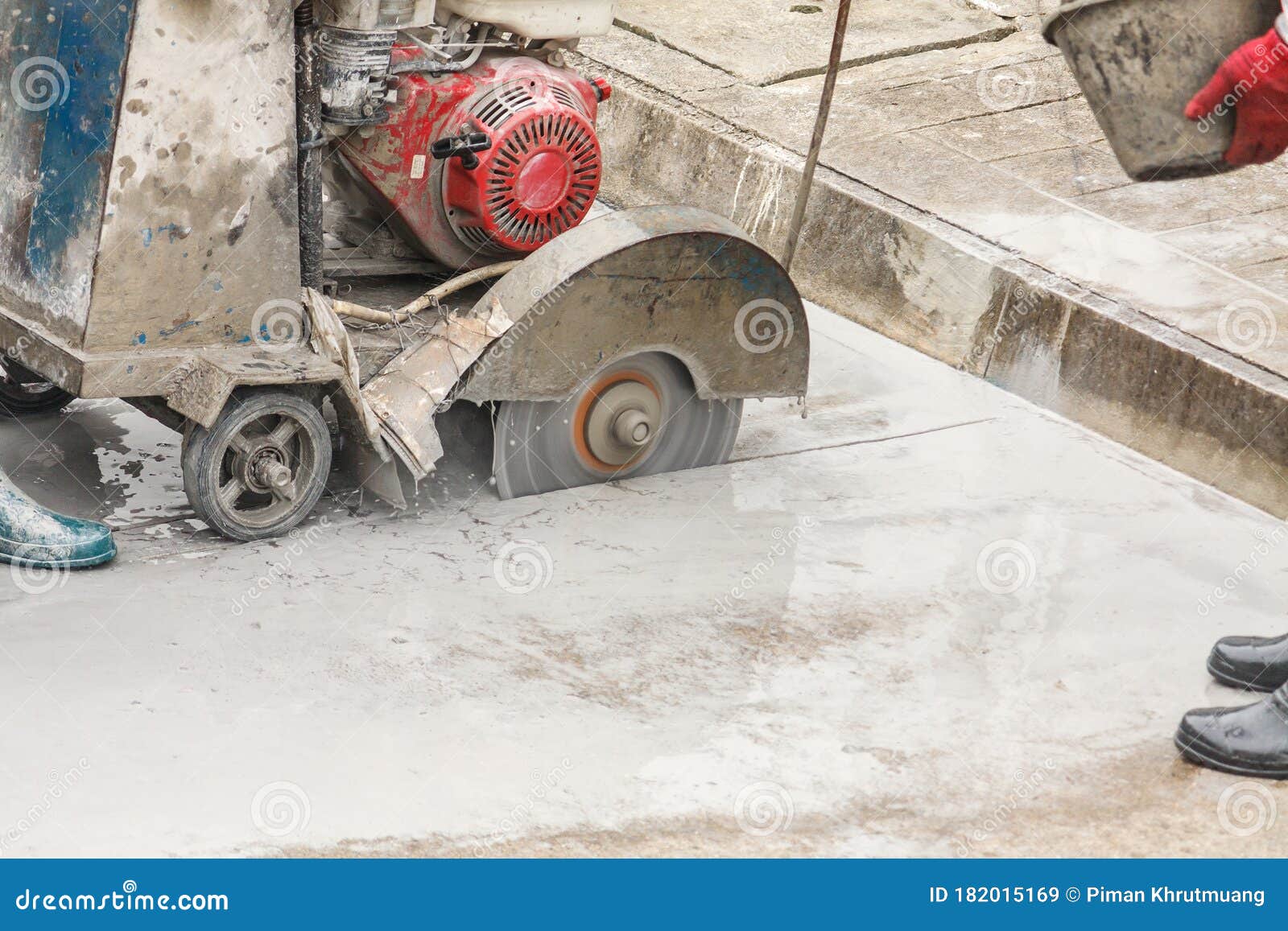 Worker Using Diamond Saw Blade Machine Cutting Concrete Road at ...