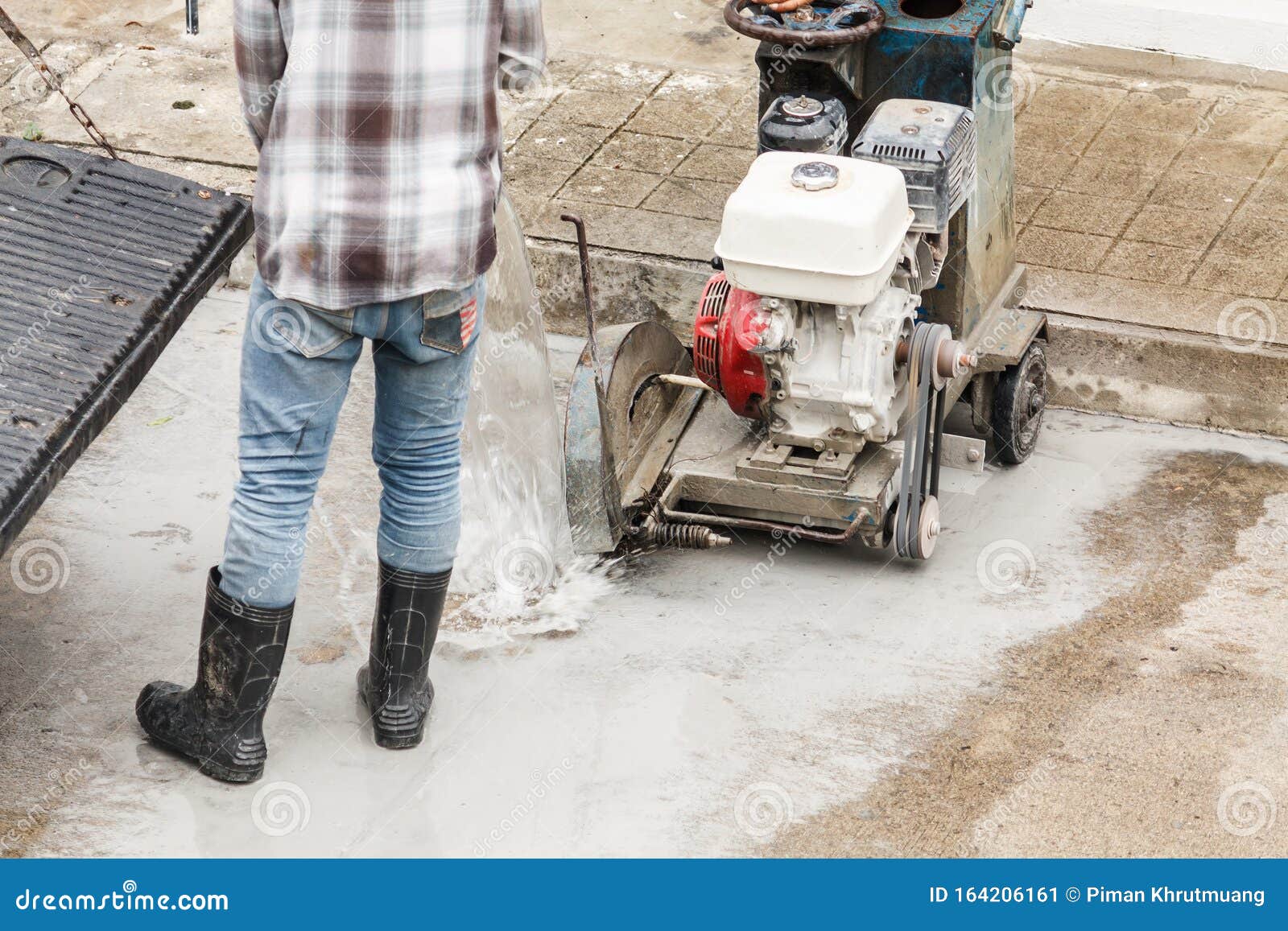 Worker Using Diamond Saw Blade Machine Cutting Concrete Road at ...
