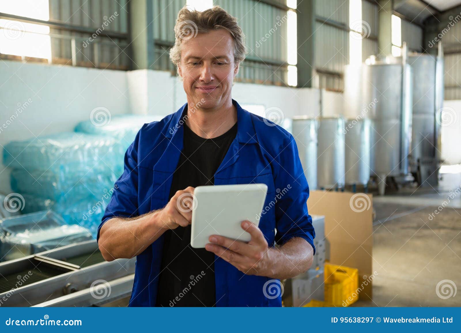 Worker Using Digital Tablet in Factory Stock Image - Image of device ...