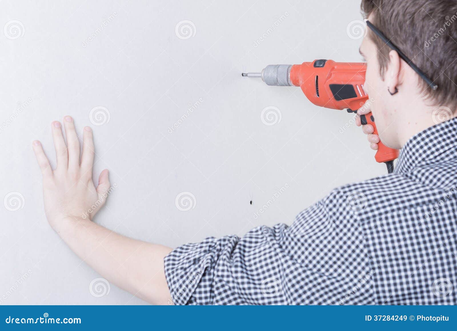 Worker using a drill stock image. Image of contractor - 37284249