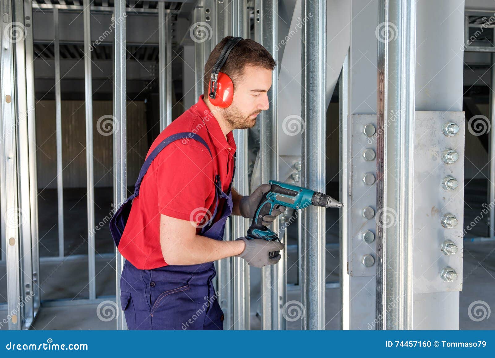 Worker using a drill stock photo. Image of carpenter - 74457160