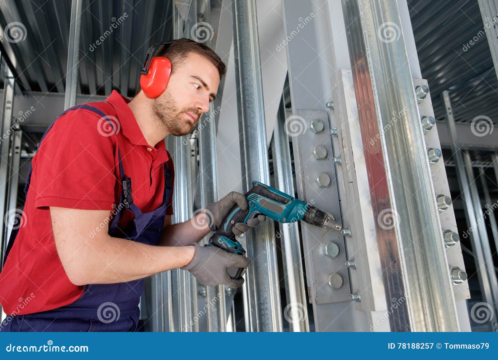 Worker using a drill stock image. Image of foreman, hardhat - 78188257