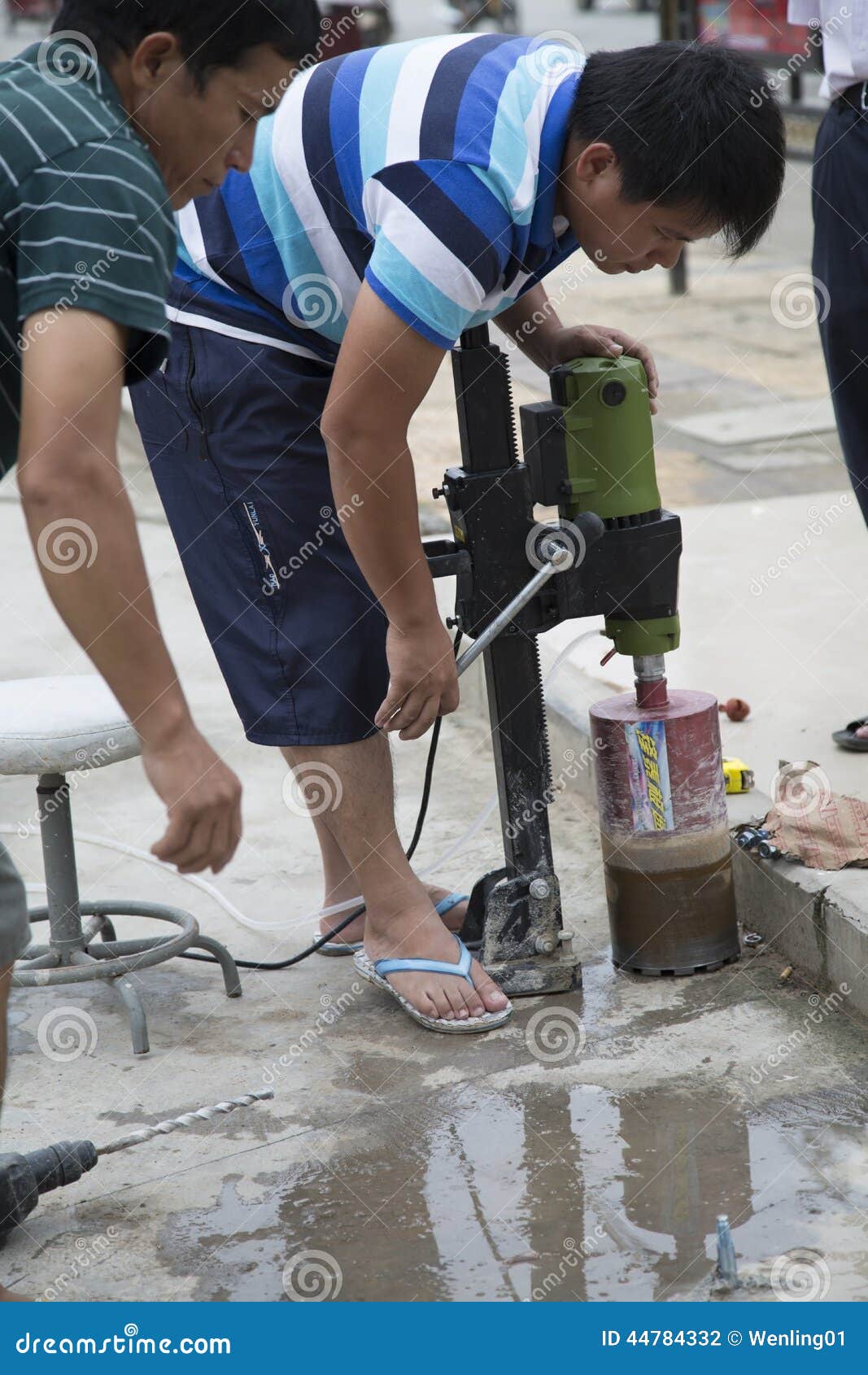 Worker using drill editorial photography. Image of worker - 44784332