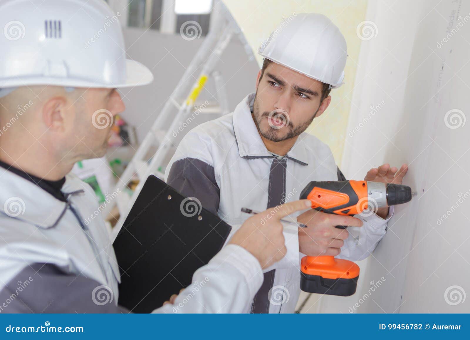 Worker Using Electric Drill Stock Photo - Image of carpenter, depth ...