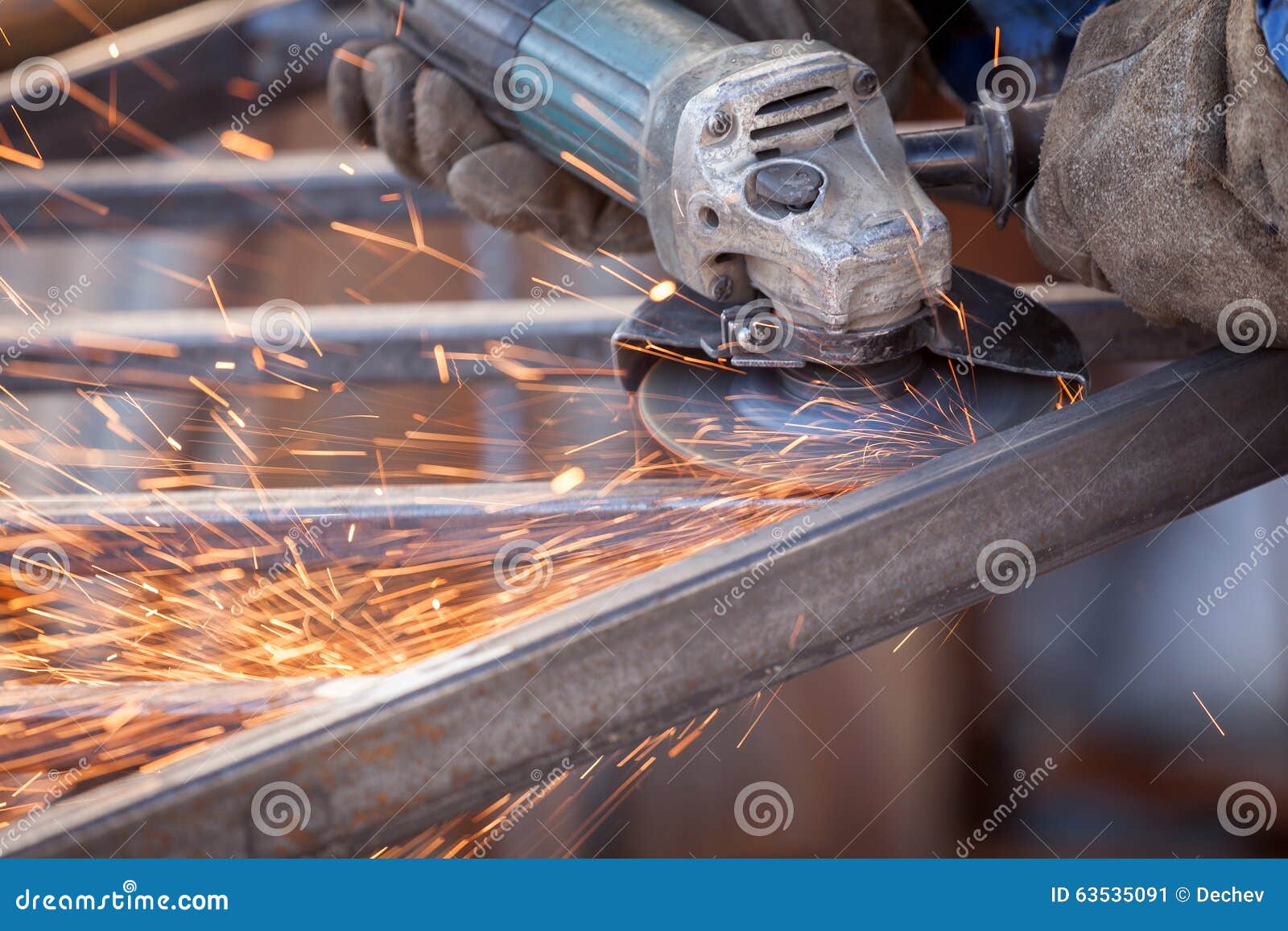 Worker Using Electric Grinder Machine Cutting Metal. Sparkles Stock ...