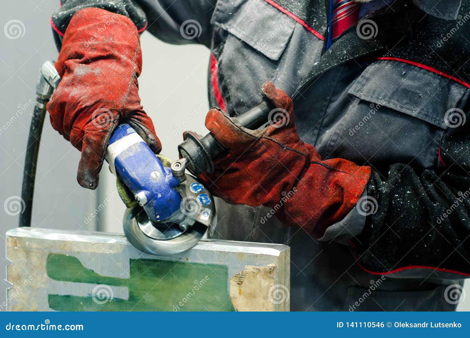 Worker using a grinder stock photo. Image of industry - 141110546