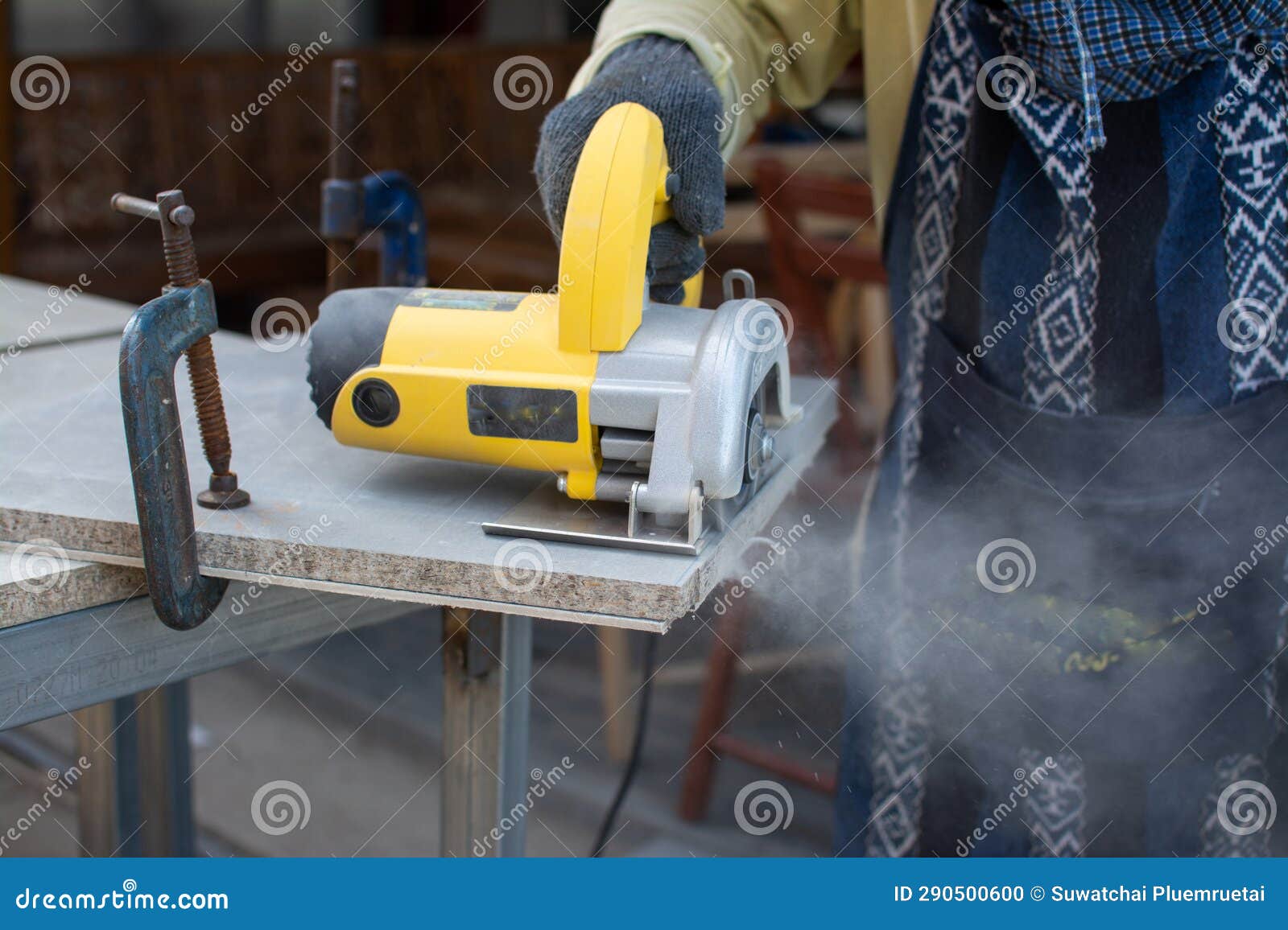 Worker Using a Grinding Machine for Cut Cement Board Stock Photo ...