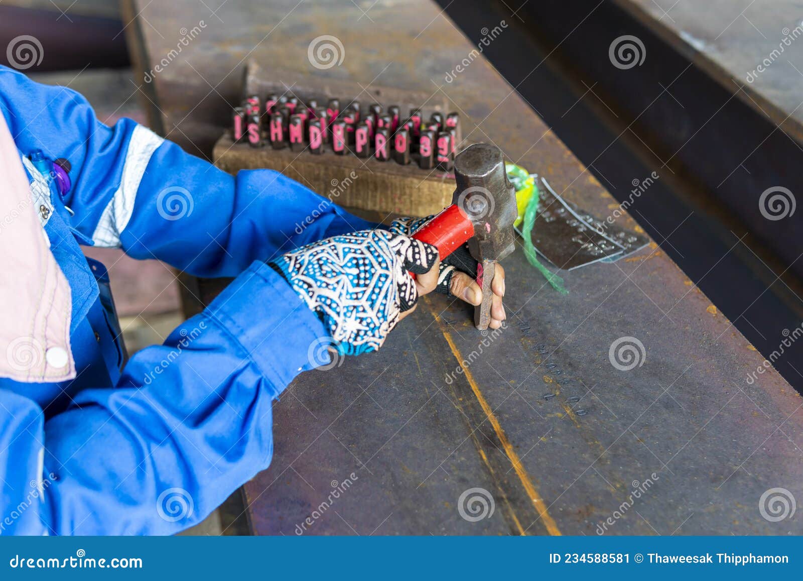 Worker are Using a Hammer To Stamp Characters and Number with Steel ...