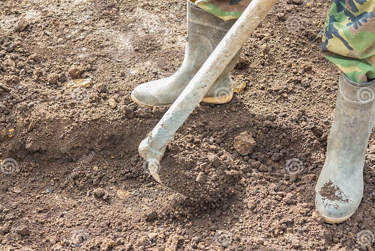 Worker Using Hoe Dig the Soil. Stock Image - Image of blur, ground ...