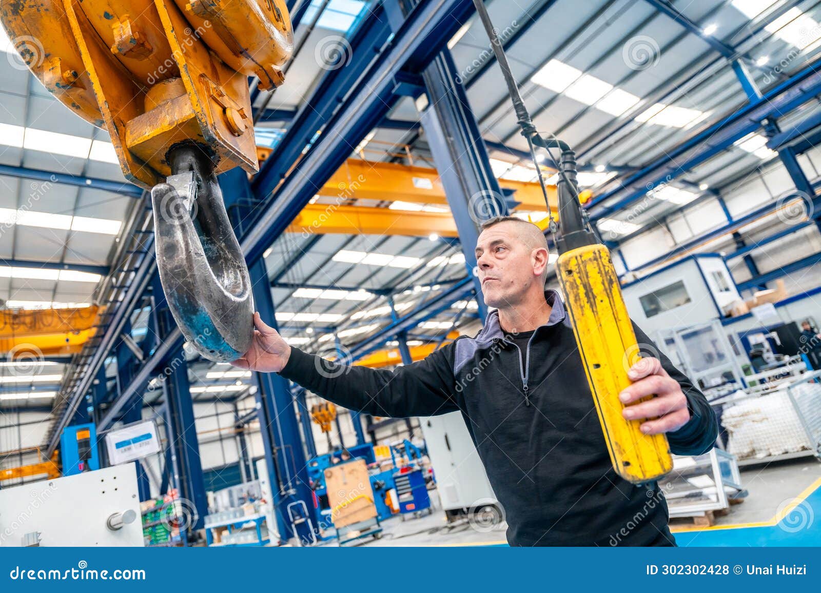 Worker Using an Industrial Cane Working in a Logistics Center Stock ...