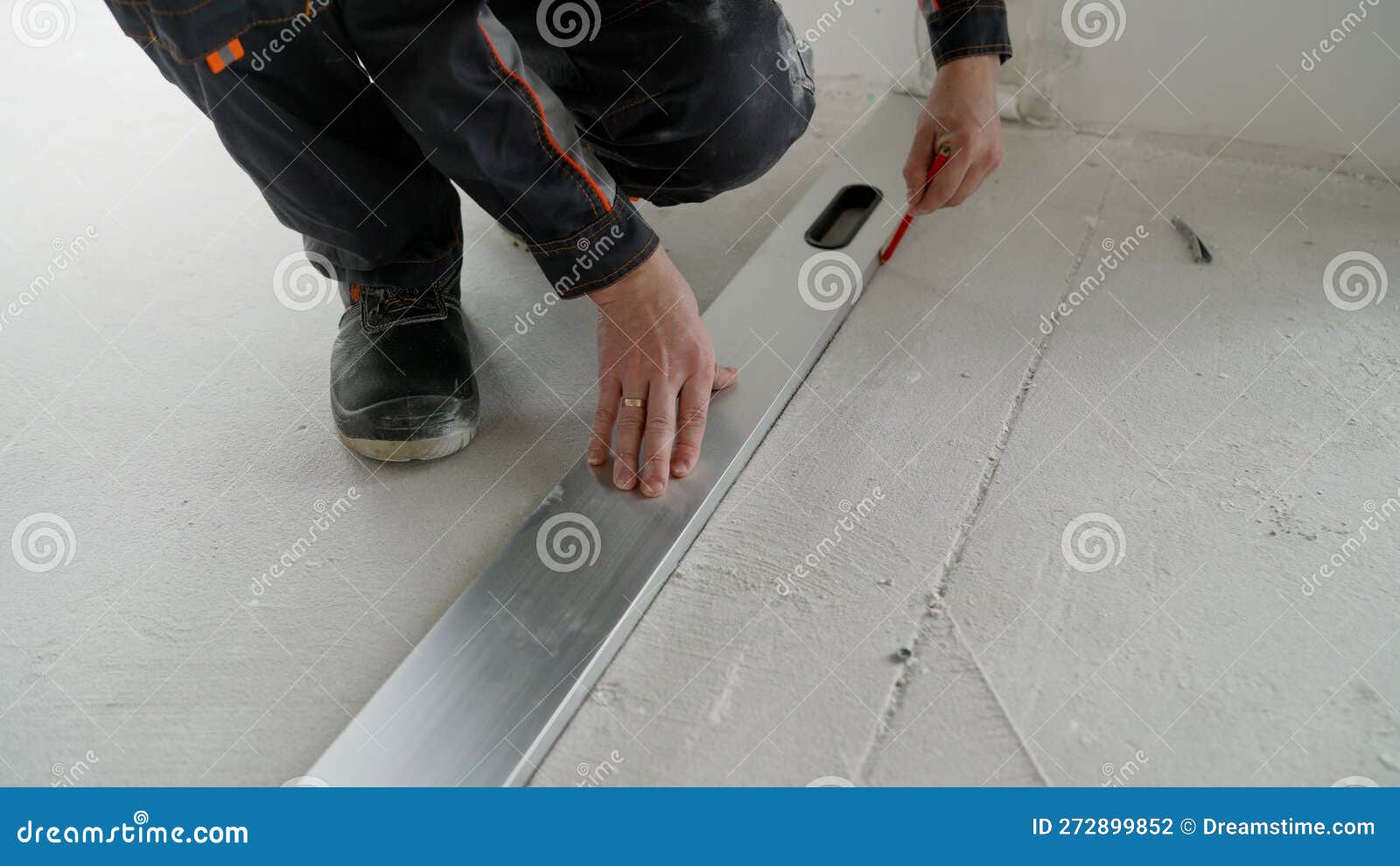 Worker Using an Industrial Pencil To Measure and Mark Ceramic Tiles at ...