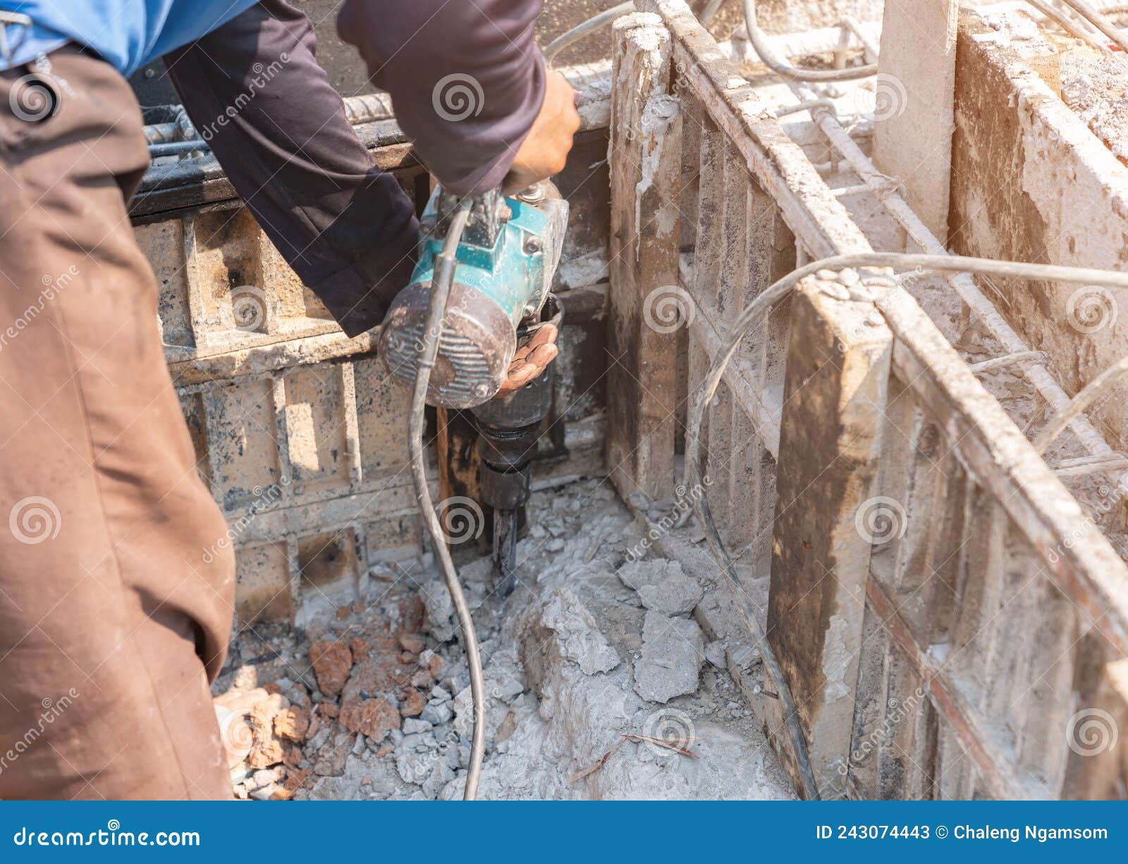 Worker Using a Jackhammer To Drill Floor for Pull Out Beam Framework ...