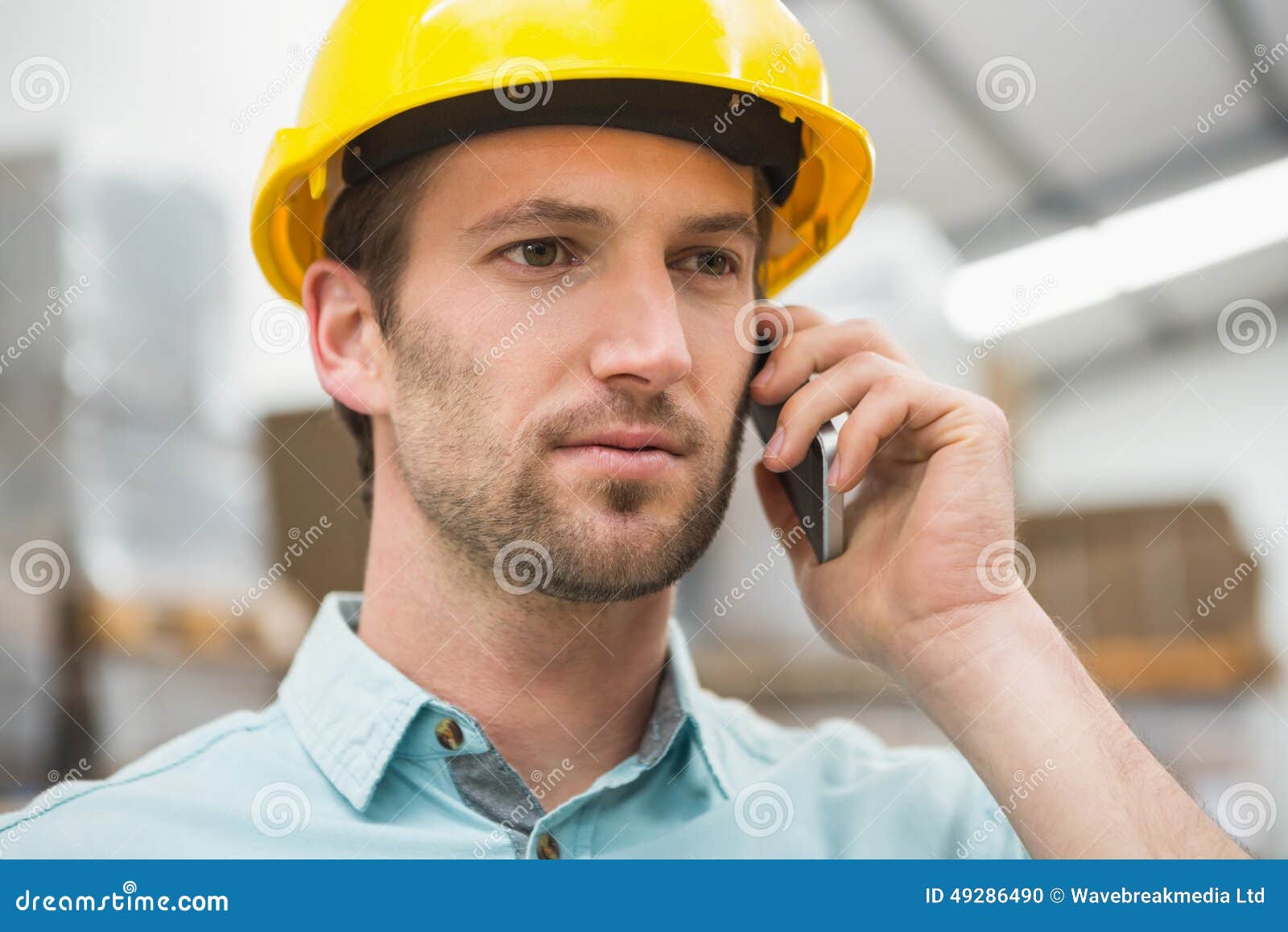 Worker Using Mobile Phone in Warehouse Stock Photo - Image of cellphone ...