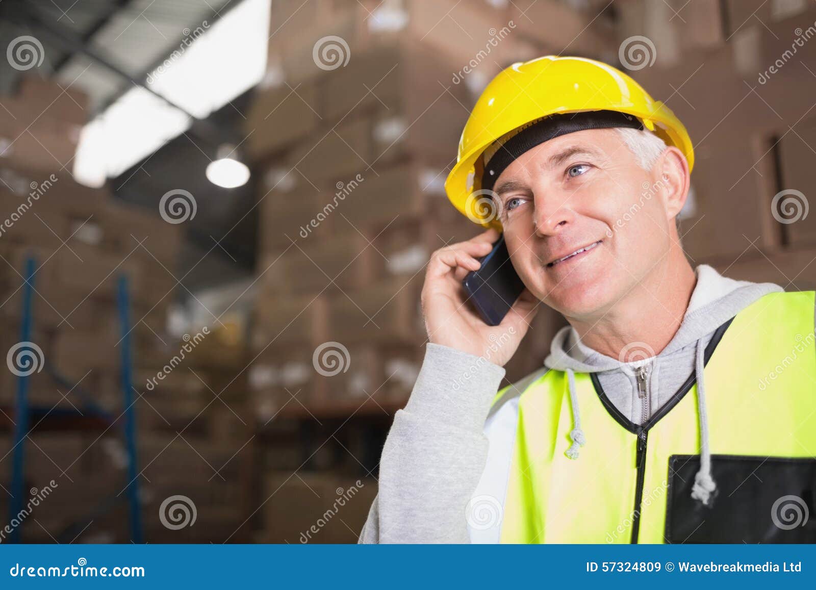 Worker Using Mobile Phone in Warehouse Stock Image - Image of indoors ...