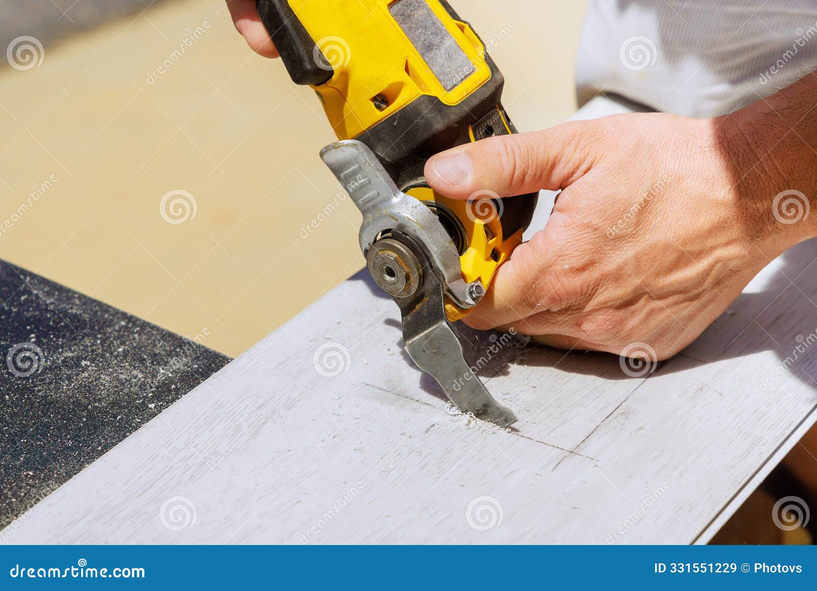Worker is Using Multitool To Make Hole in a Laminate Panel for an ...