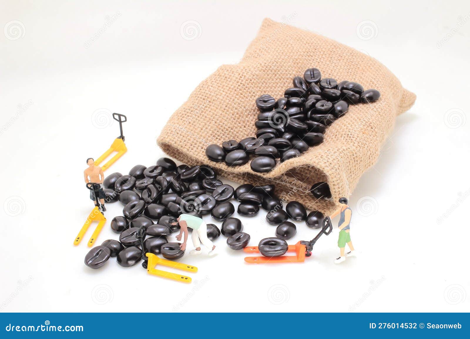A Worker Using Pallet Jack To Lift Heavy Roasted Coffee Bean Stock ...