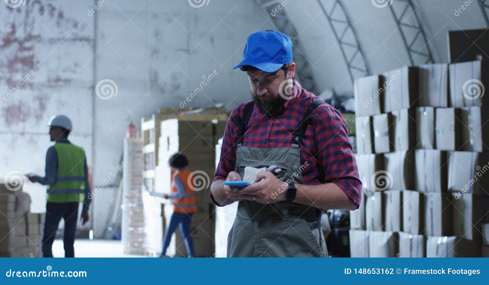 Worker Using Phone in a Warehouse Stock Photo - Image of inside, worker ...