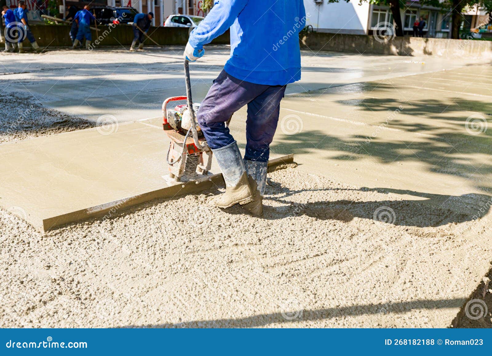 Worker is Using Power Tool with Engine, Compactor, for Level and ...
