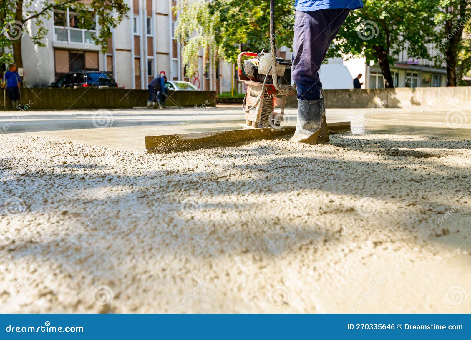 Worker is Using Power Tool with Engine, Compactor, for Level and ...
