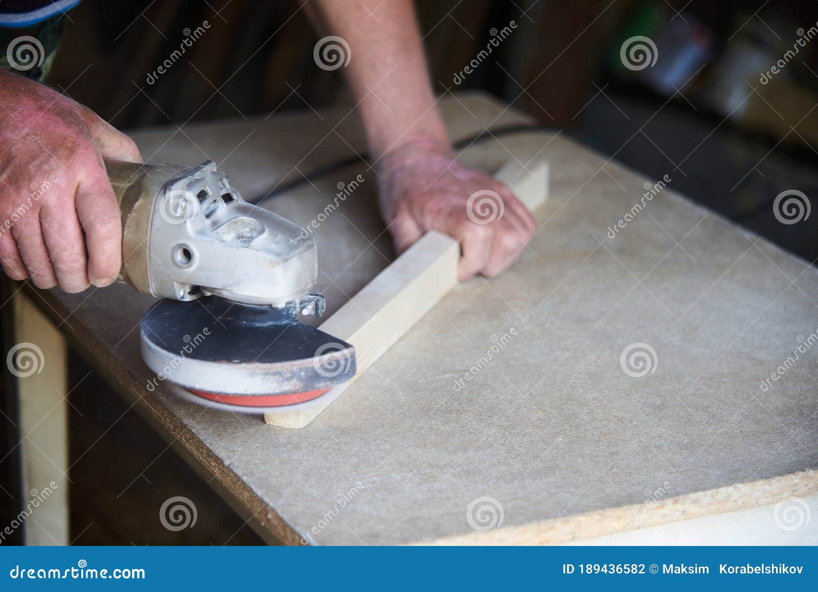 A Worker Using a Sanding Machine Works with Wood in a Carpenter`s ...