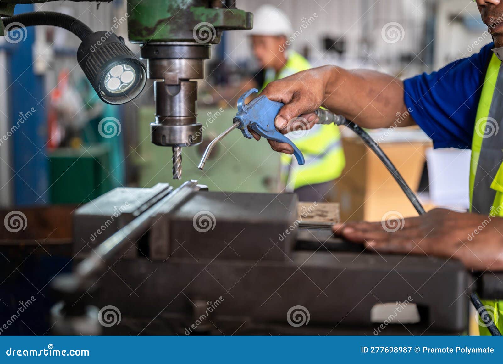 A Worker Using Scrap Dust Blower at Lathe in Factory Stock Image ...