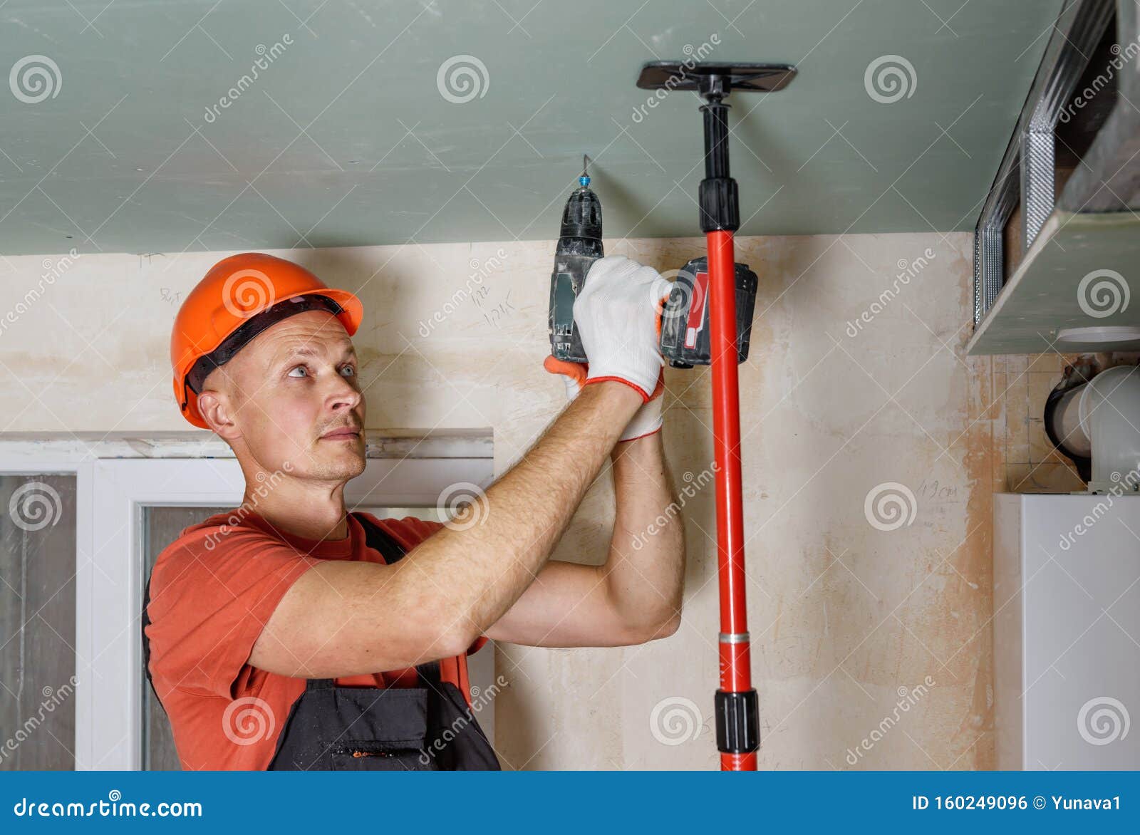 Plasterboard Installation on the Ceiling Stock Photo - Image of holds ...