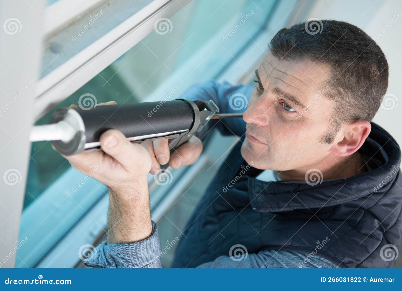Worker Using Silicone Pistol on Windows Stock Photo - Image of filler ...
