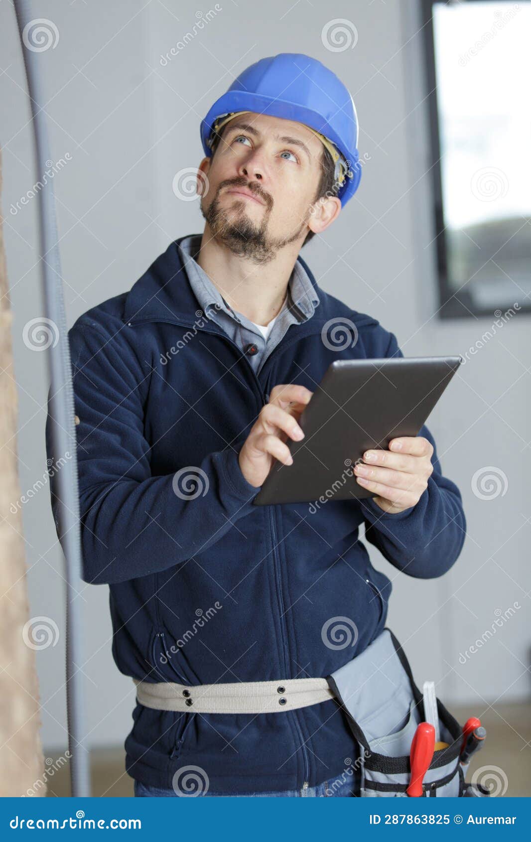 Worker Using Tablet in Construction Site Stock Image - Image of happy ...