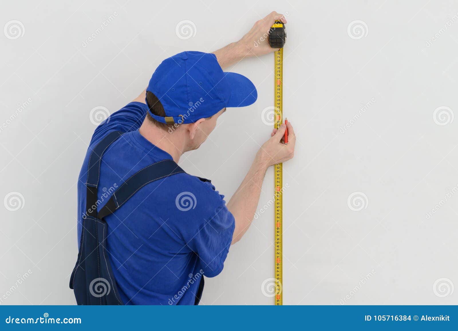 Worker Using a Tape Measure Measures Distance Stock Photo - Image of ...