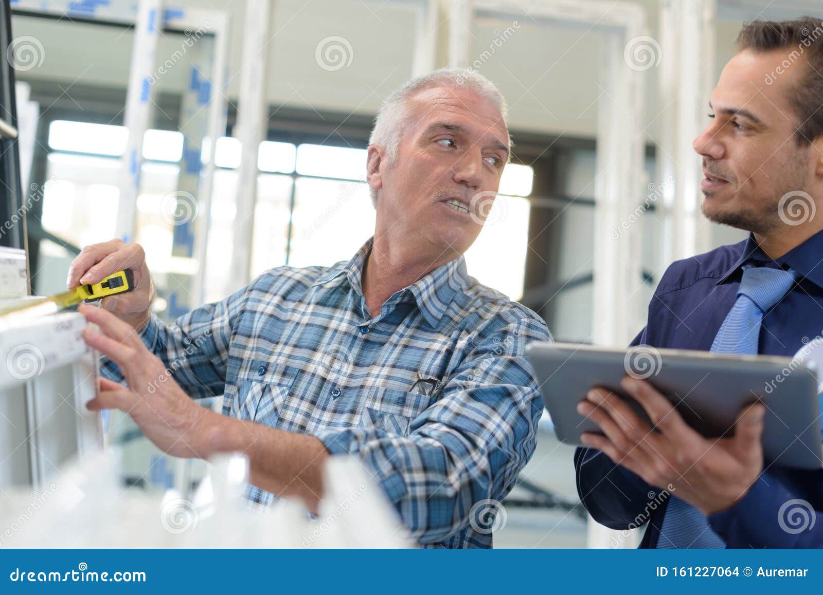 Worker Using Tape-measure in Plastic Window and Door Manufacturing ...