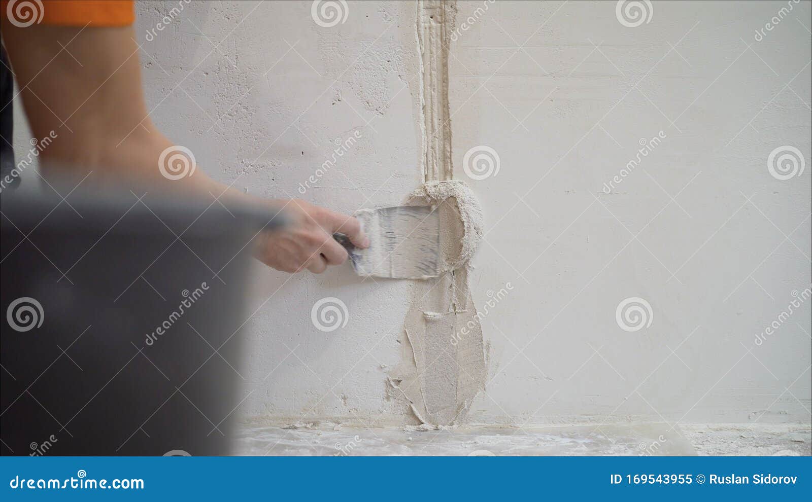 Worker Using the Trowel for Plastering the Concrete Wall at the ...