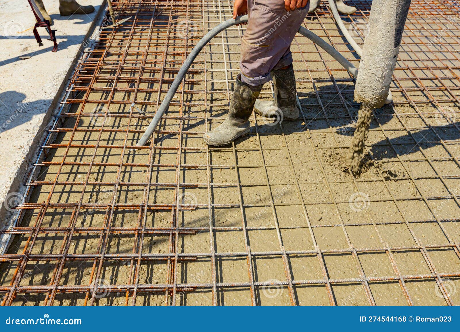 Worker is Using Electric Vibratory To Compact Concrete in Foundation ...