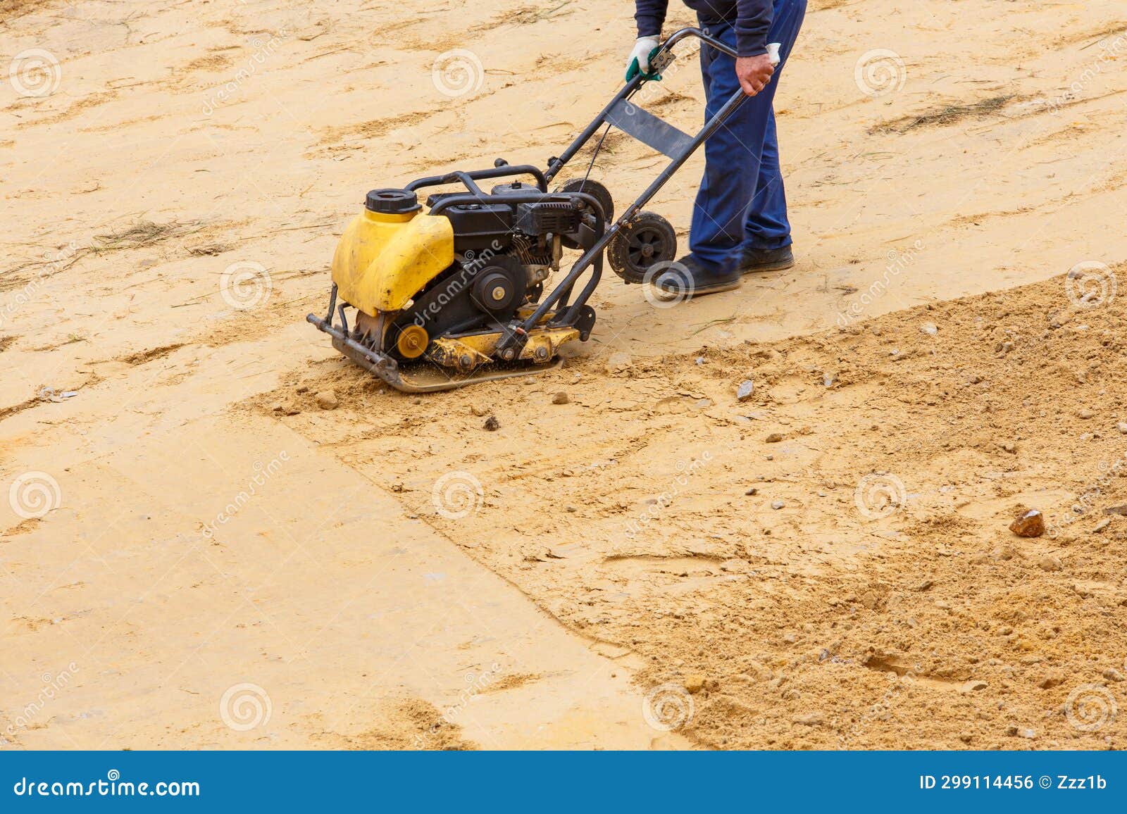 Worker Using Vibratory Plate Compactor for Compaction Sand during Path ...