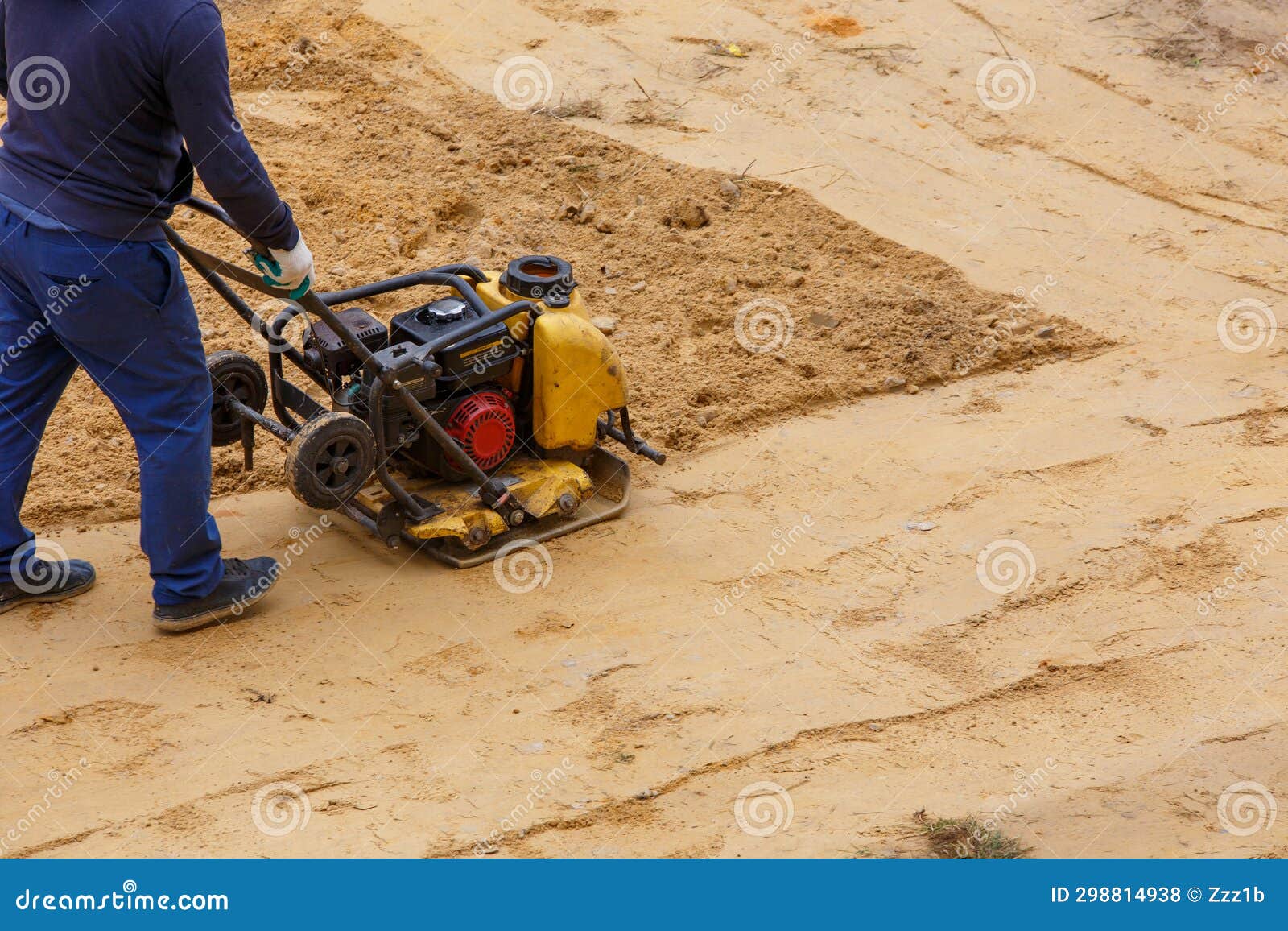 Worker Using Vibratory Plate Compactor for Compaction Sand during Path ...