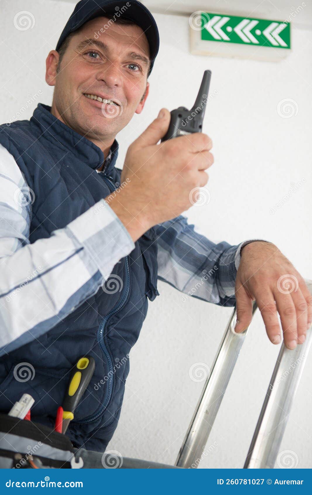 Worker using walkie talkie stock image. Image of inspector - 260781027