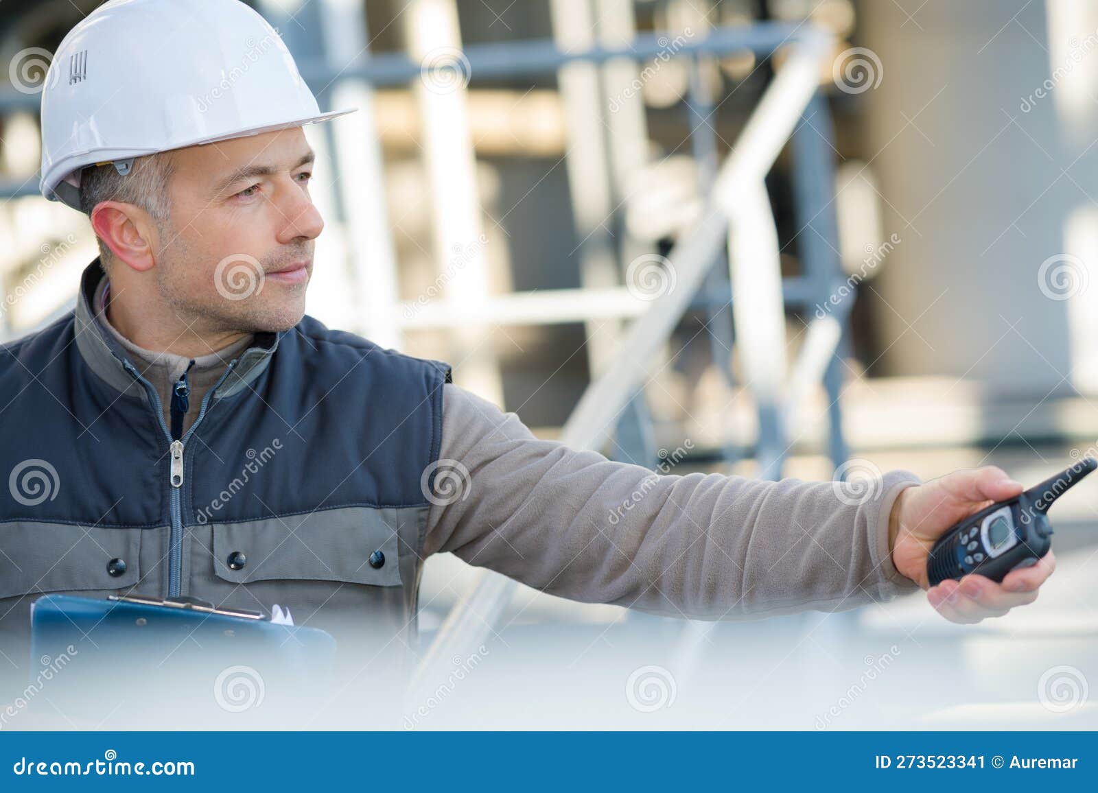 Worker using walkie talkie stock image. Image of shipyard - 273523341