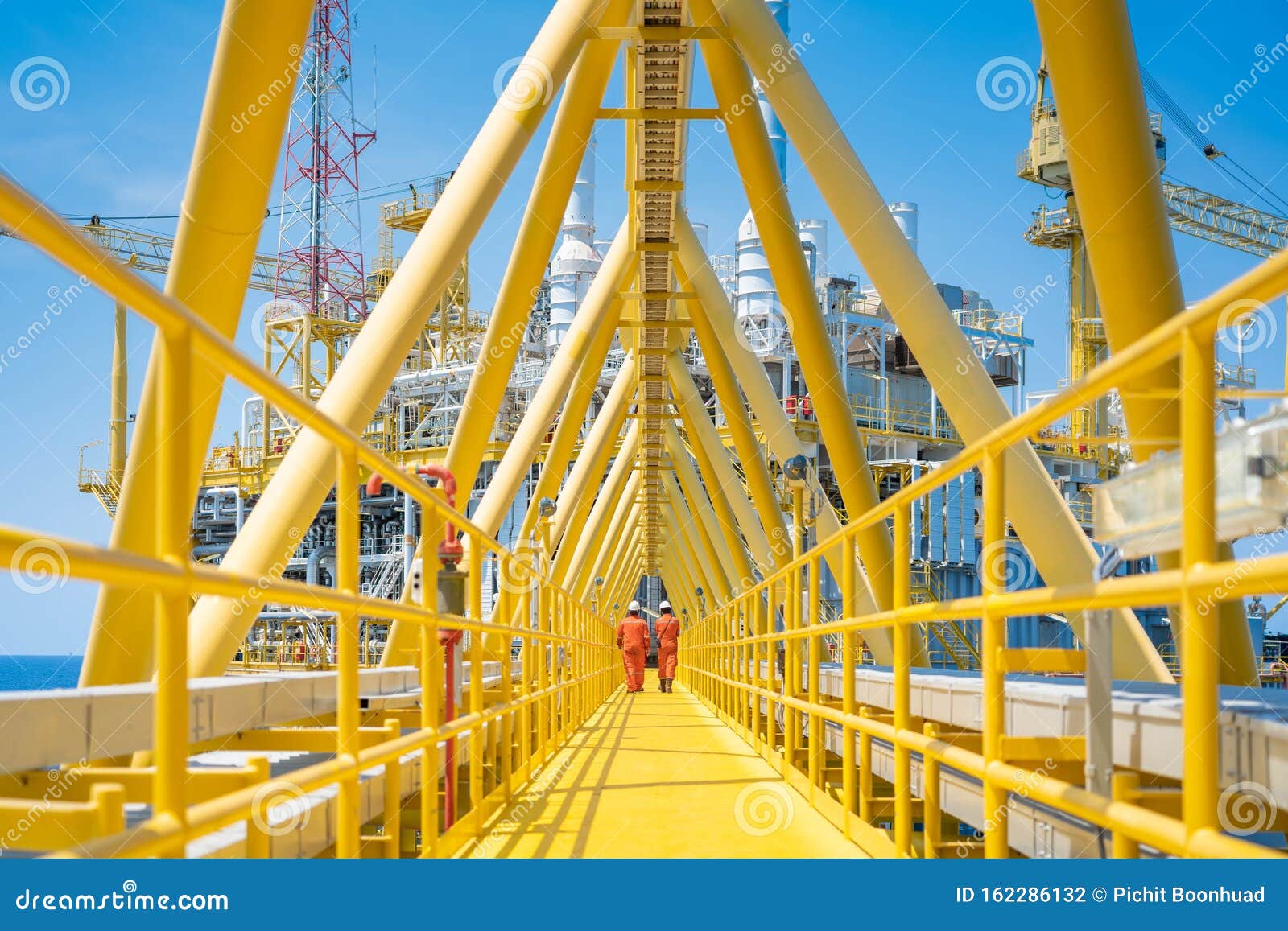 Worker Walking at the Connection Bridge between Quarter Platform and ...