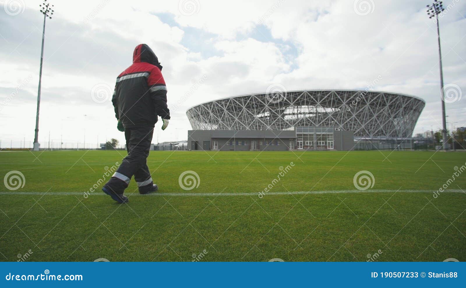 Worker is Walking on Football Field Stock Image - Image of area, blades ...