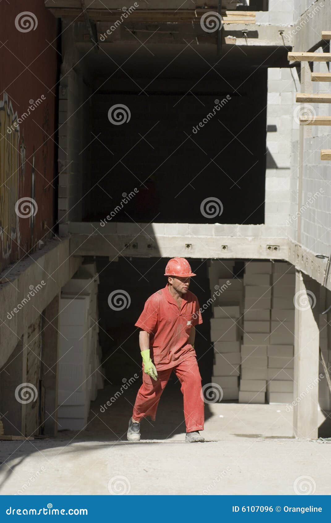 Worker Walks Across Jobsite - Vertical Picture. Image: 6107096