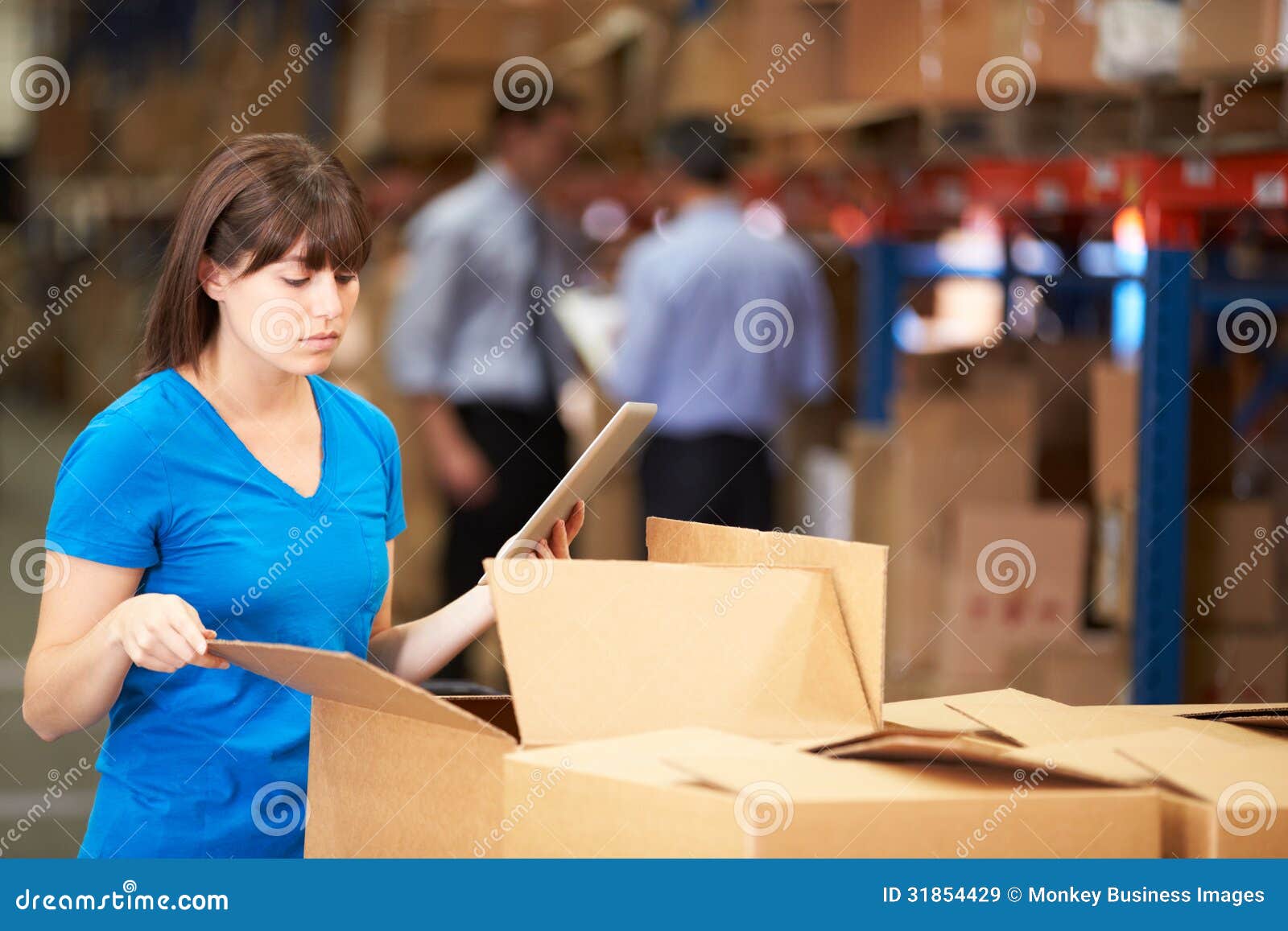 Worker in Warehouse Checking Boxes Using Digital Tablet Stock Image ...