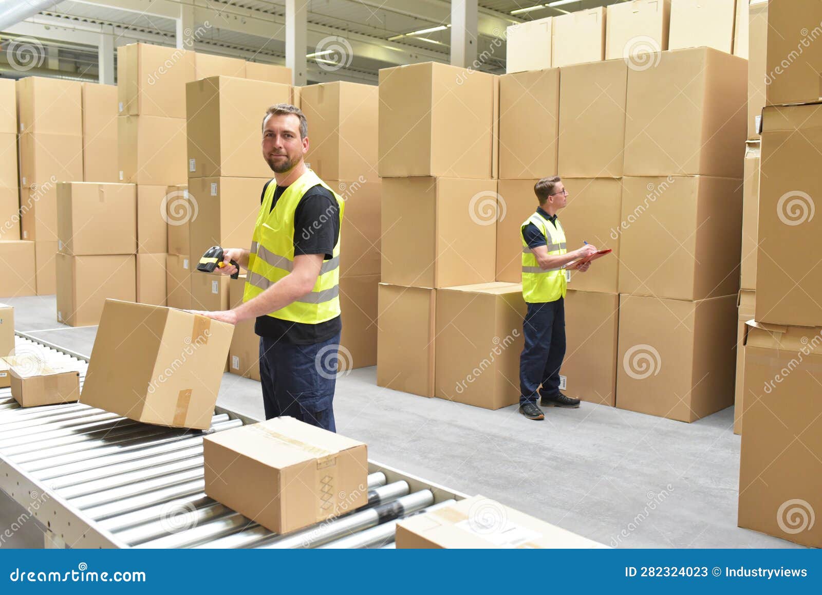 Worker in a Warehouse in the Logistics Sector Processing Packages on ...