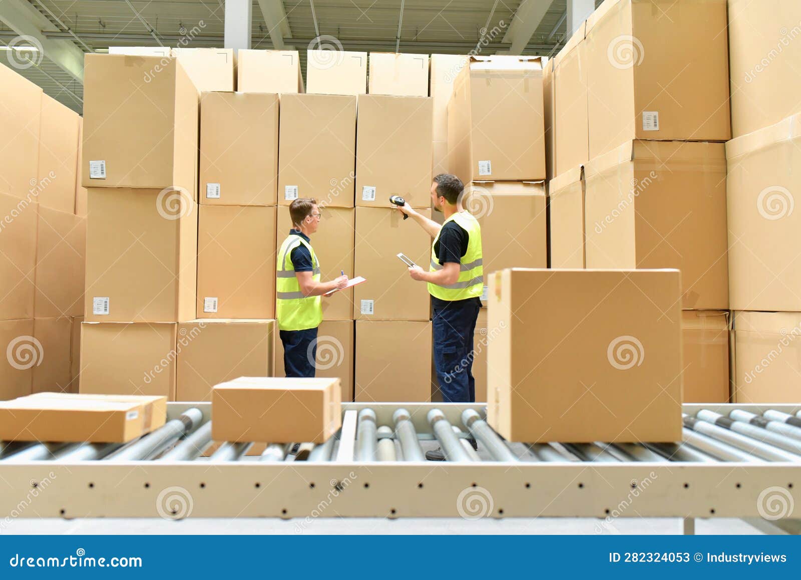 Worker in a Warehouse in the Logistics Sector Processing Packages on ...