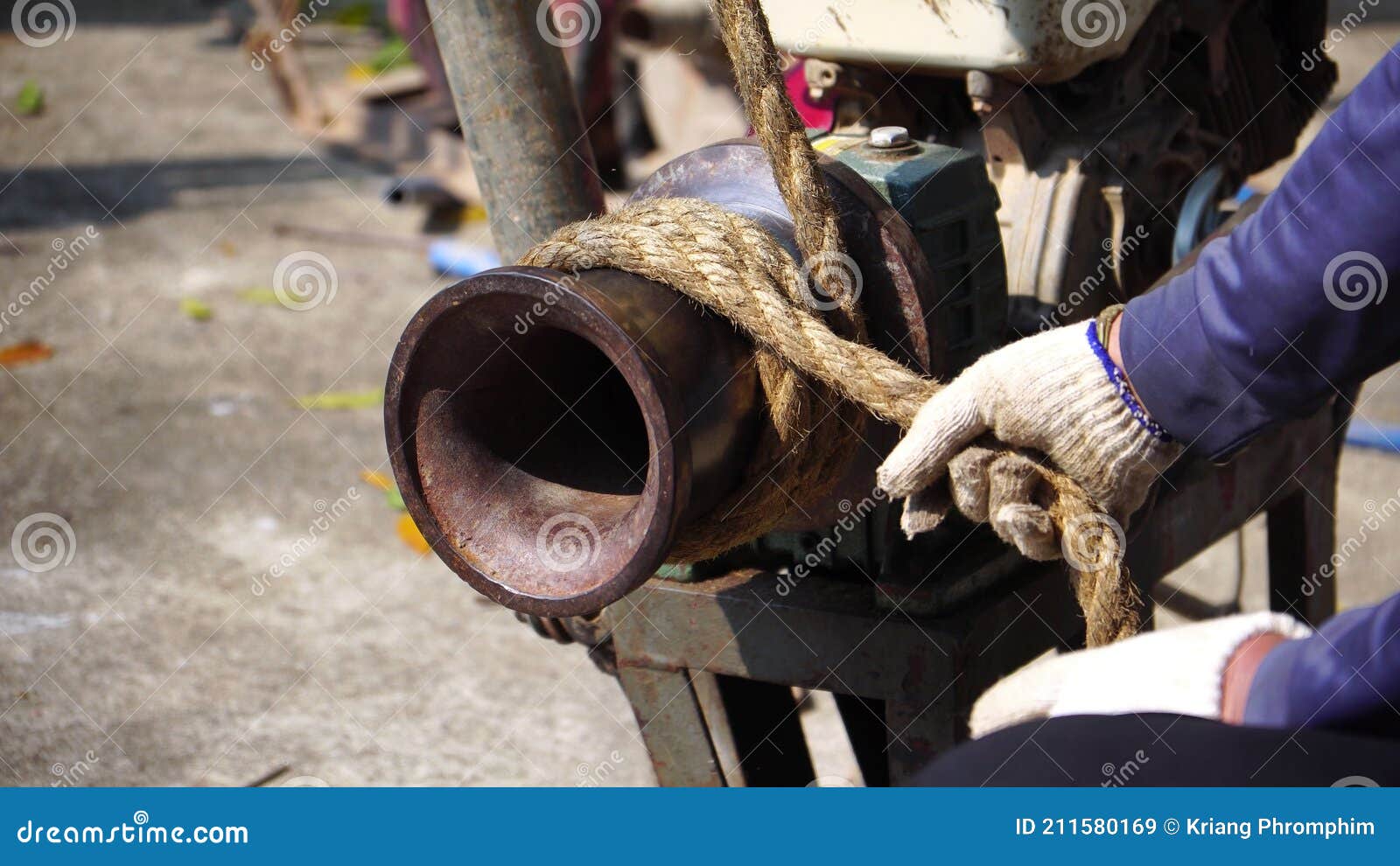 Worker Was Pulling the Rope from on Pulleys of Engine. Stock Image ...