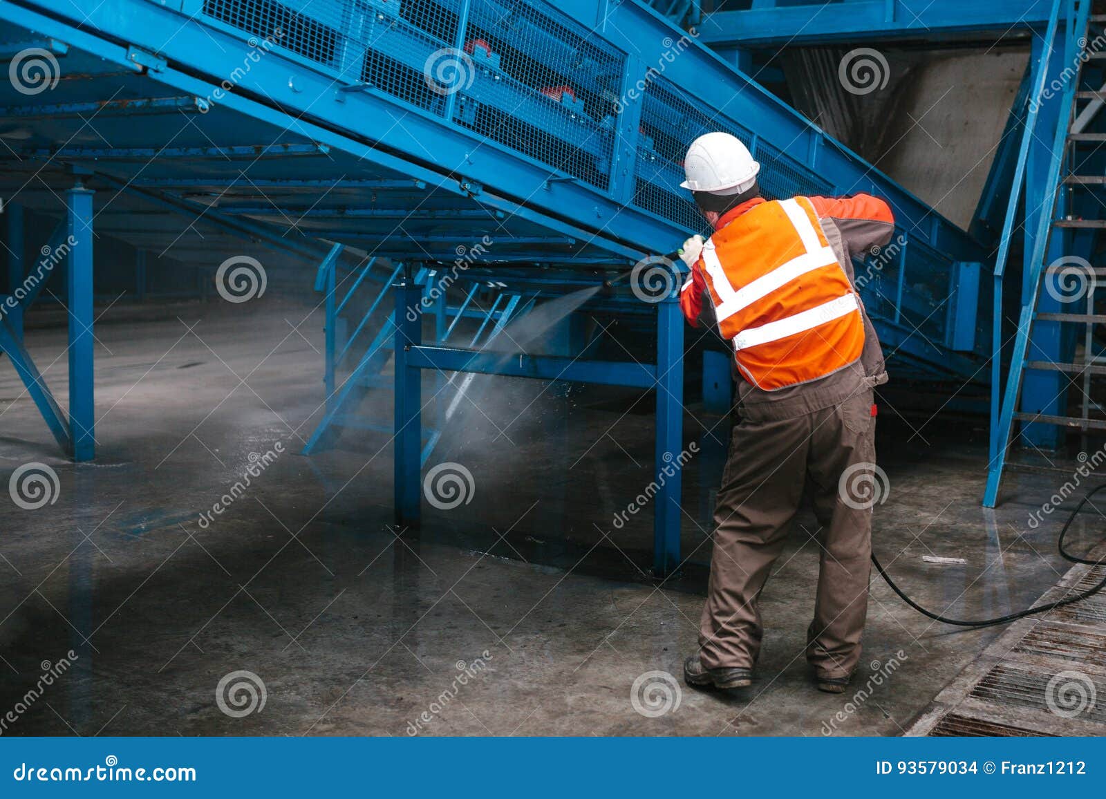 The Worker Washes the Equipment at the Waste Sorting Plant. Waste ...