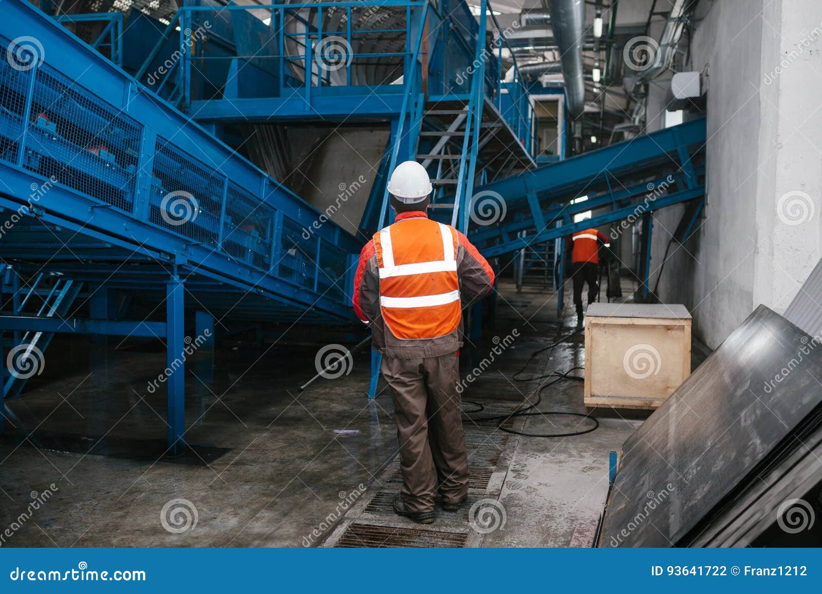 The Worker Washes the Equipment at the Waste Sorting Plant. Waste ...