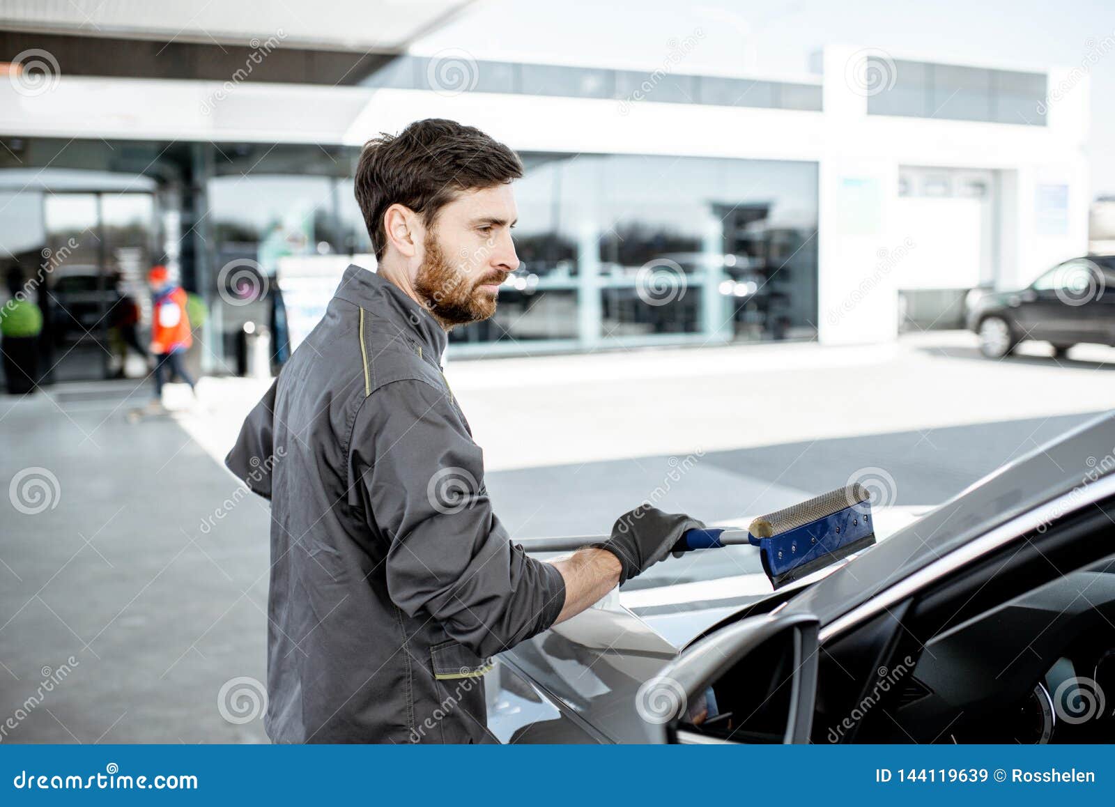 Worker Washing Car Windshield at the Station Stock Image - Image of ...