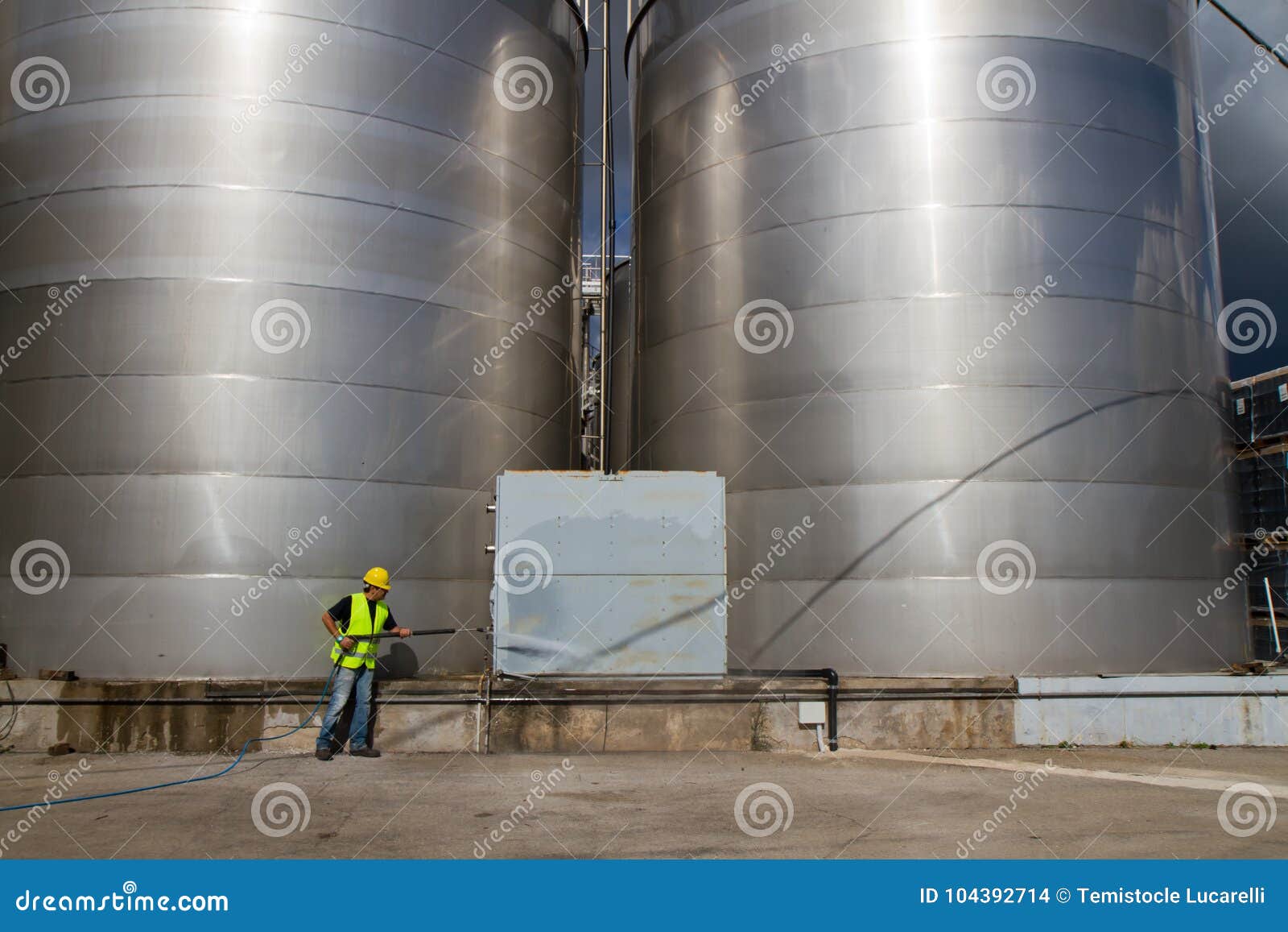 Worker Washing Industrial Site Stock Photo - Image of arrow, laborer ...